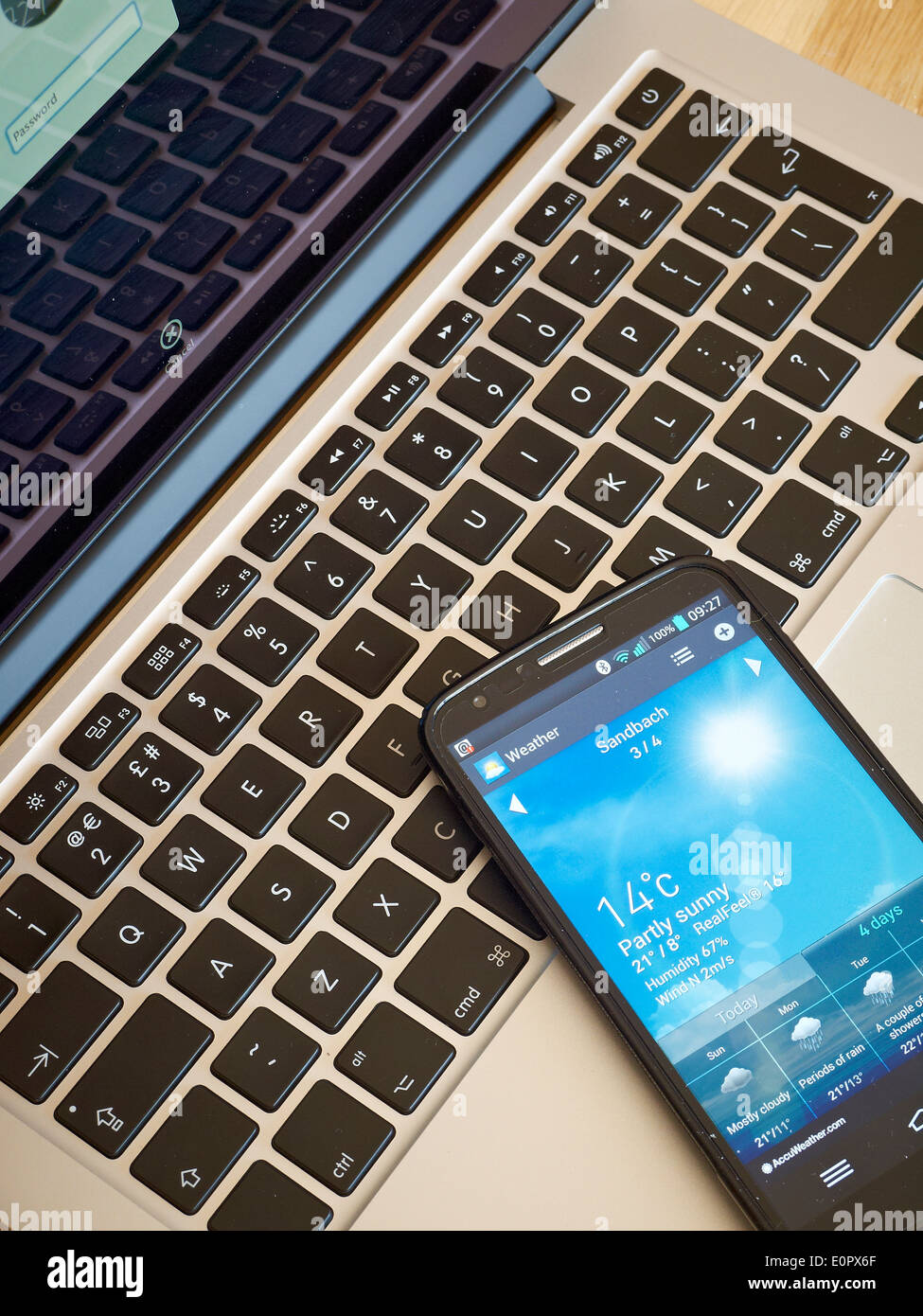 Smart phone on laptop keyboard Stock Photo - Alamy