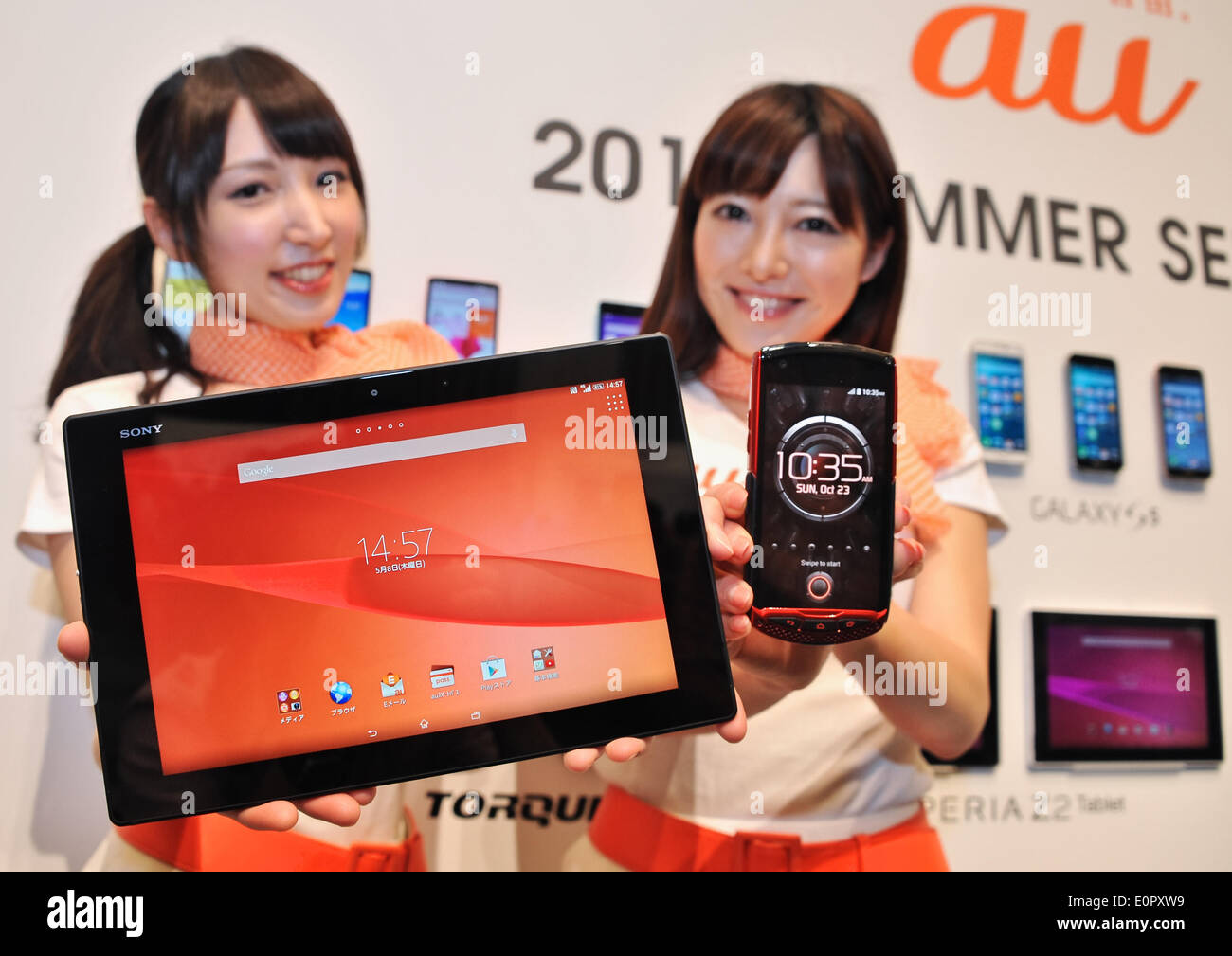 KDDI, May 8, 2014, Tokyo, Japan : Models show KDDI's new mobile devices ...