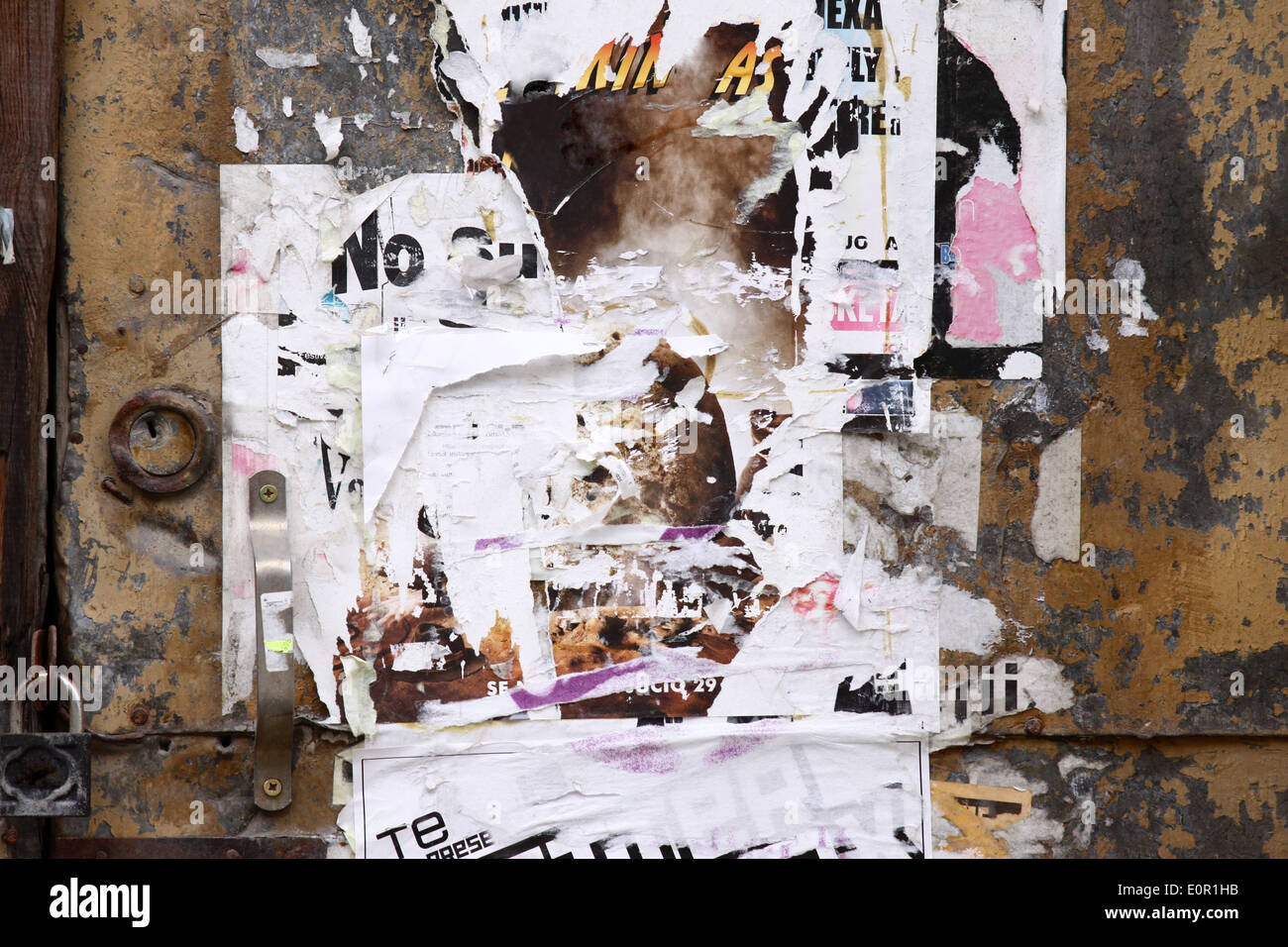 Rusty grunge door with old posters. Urban scene background Stock Photo ...