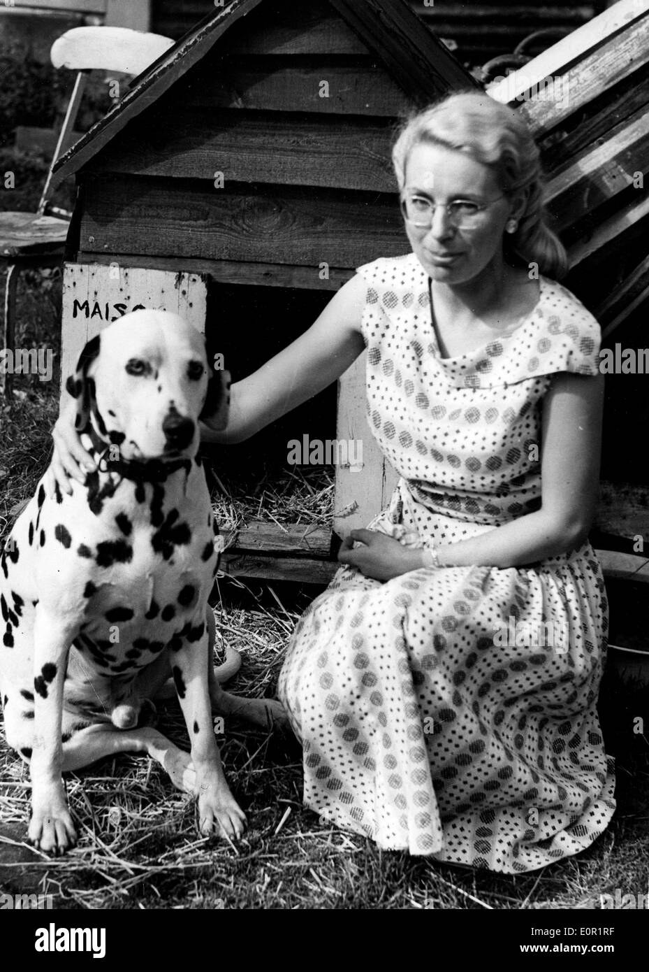 Woman sits dog in Black and White Stock Photos & Images - Alamy