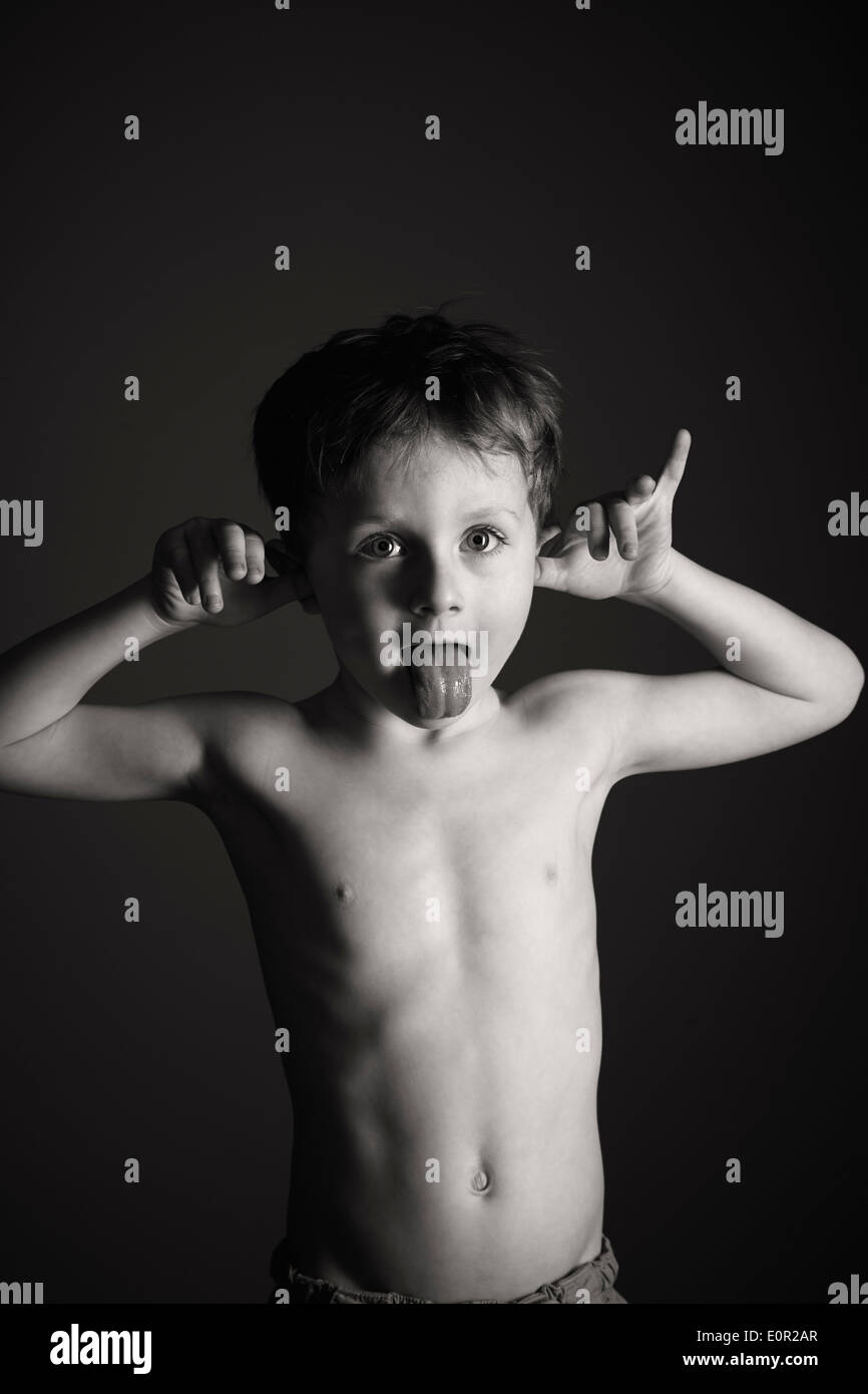 Boy sticking out tongue hi-res stock photography and images - Alamy