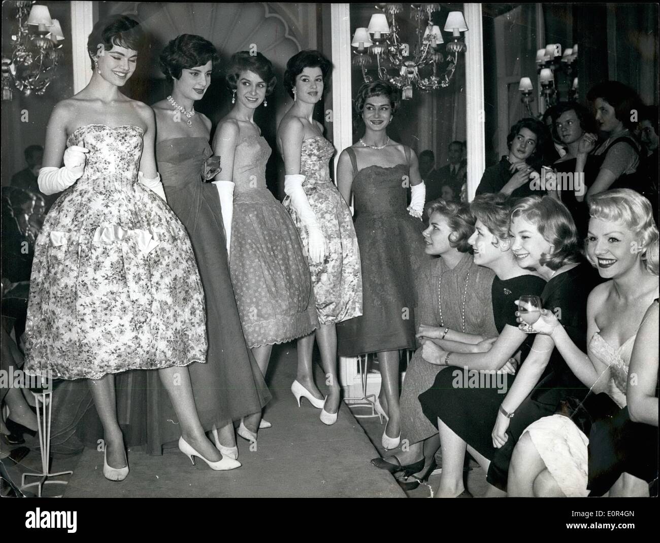 Mar. 03, 1958 - Dressed in newspapers. Photo shows six charming Paris ...