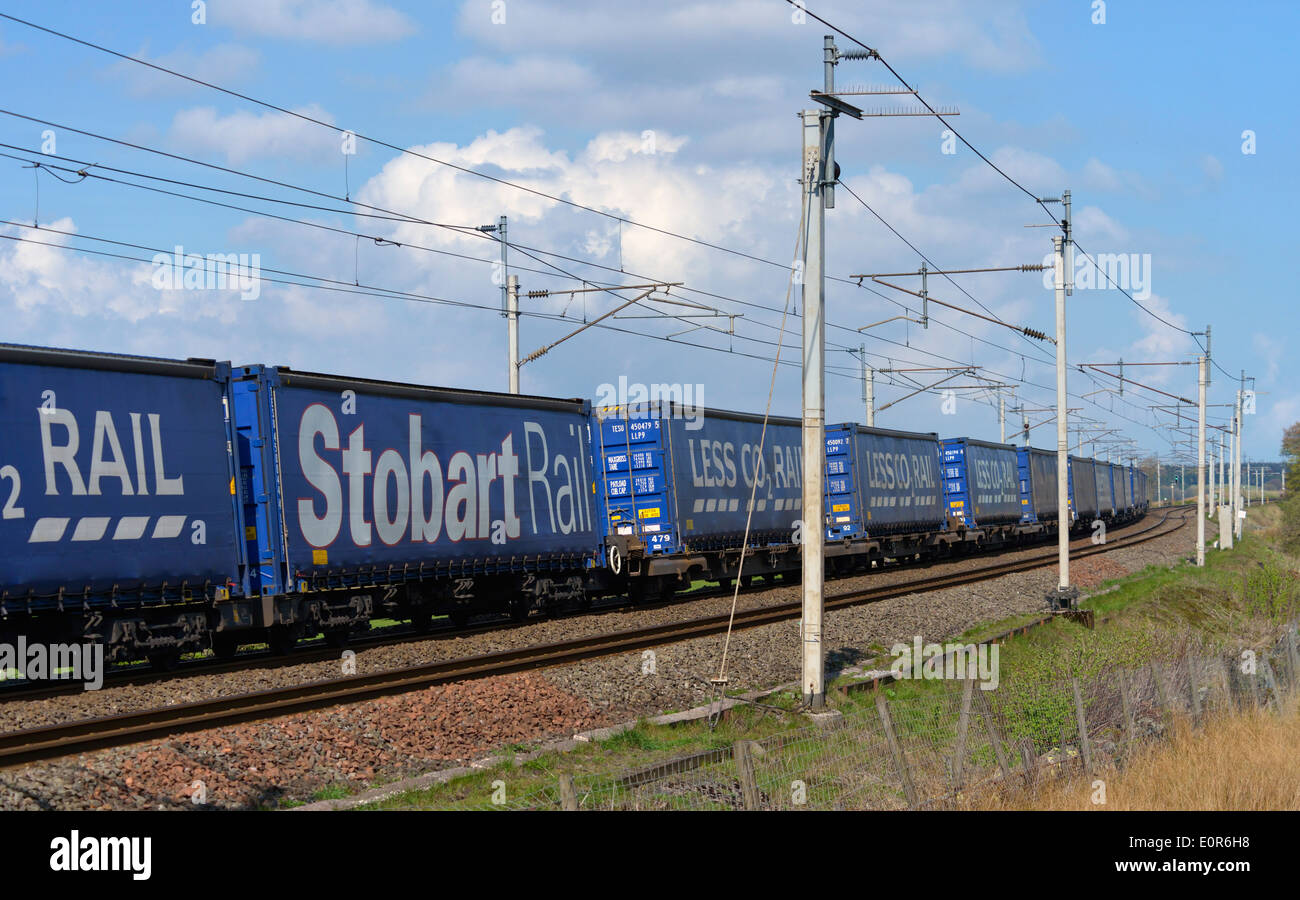 Tesco 'LESS CO2 RAIL' and Stobart Rail container wagons at speed. Scout ...