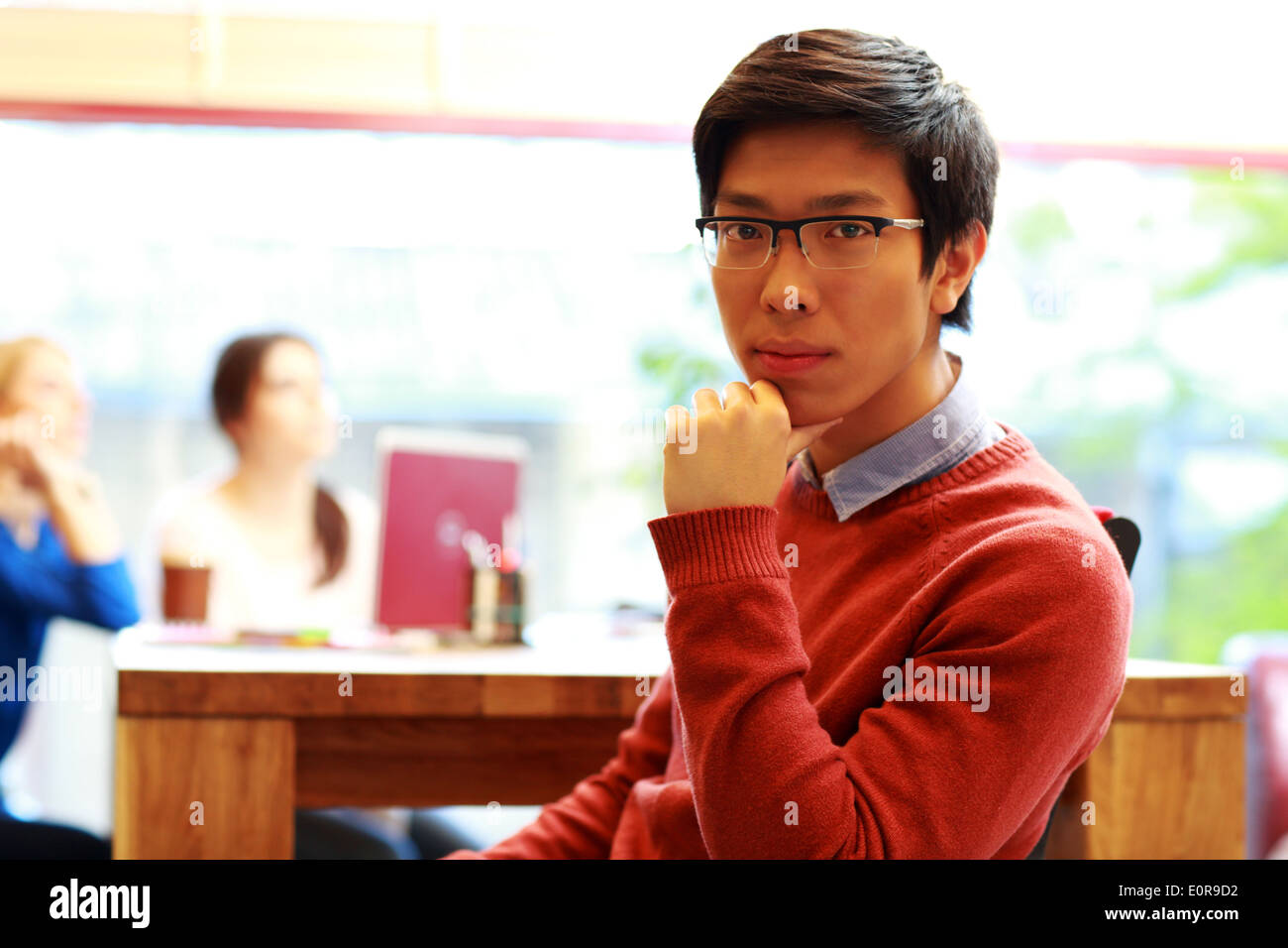 Young asian male student sitting in classroom Stock Photo - Alamy