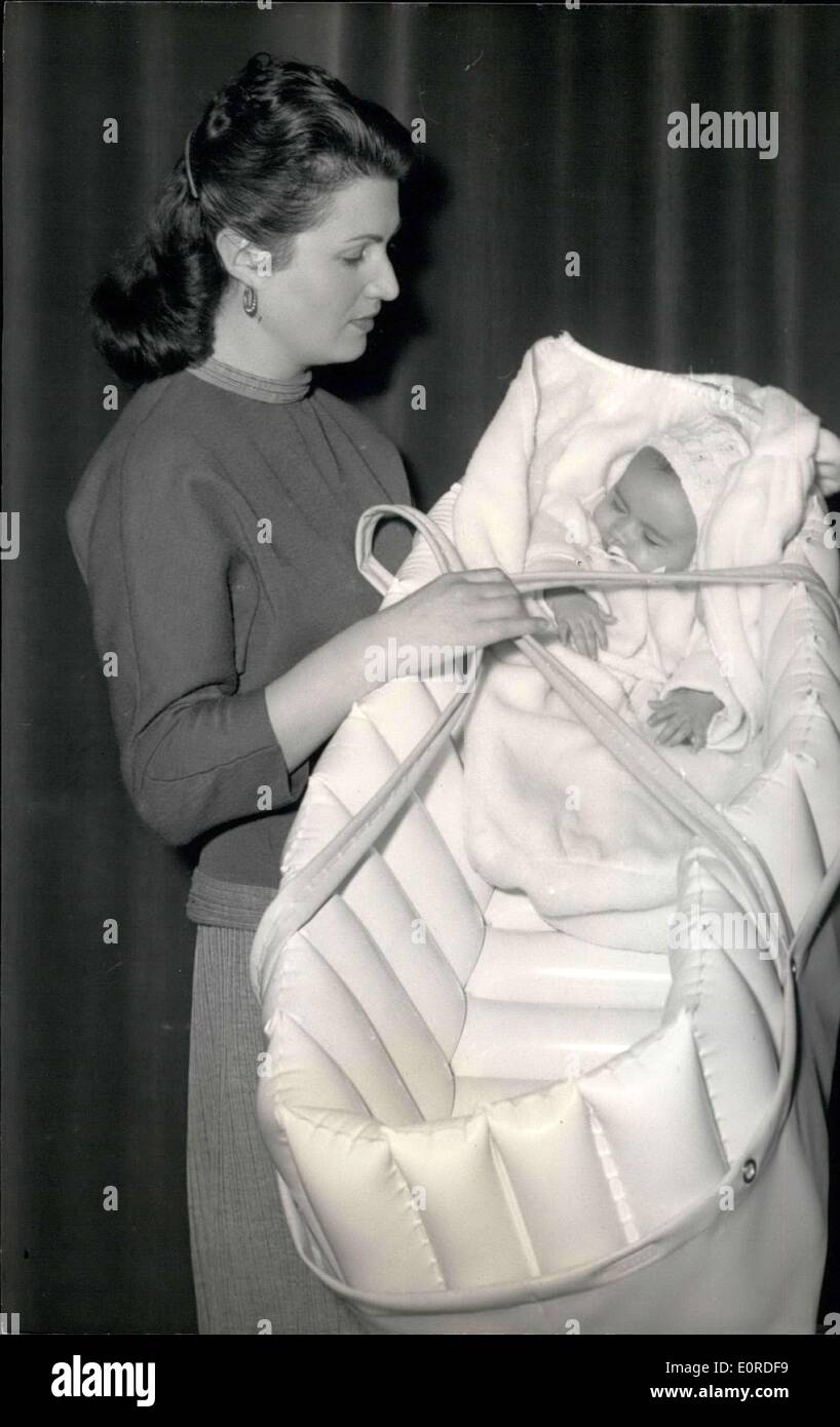 Mar. 16, 1959 - Here is a woman with her baby in a portable cradle ...