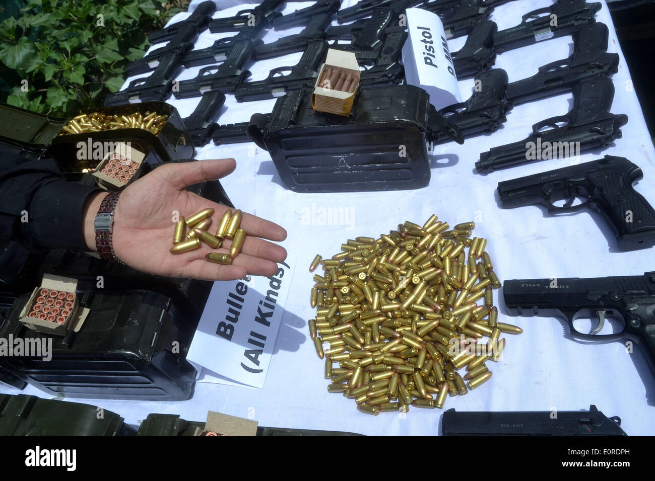 Quetta. 19th May, 2014. A Pakistani security official displays seized ...
