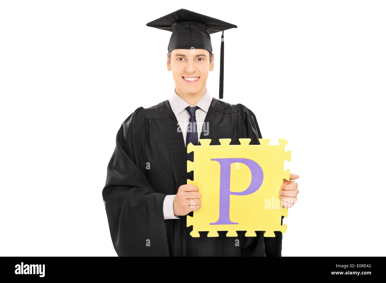 Male student holding a piece of puzzle with the letter p on it Stock ...