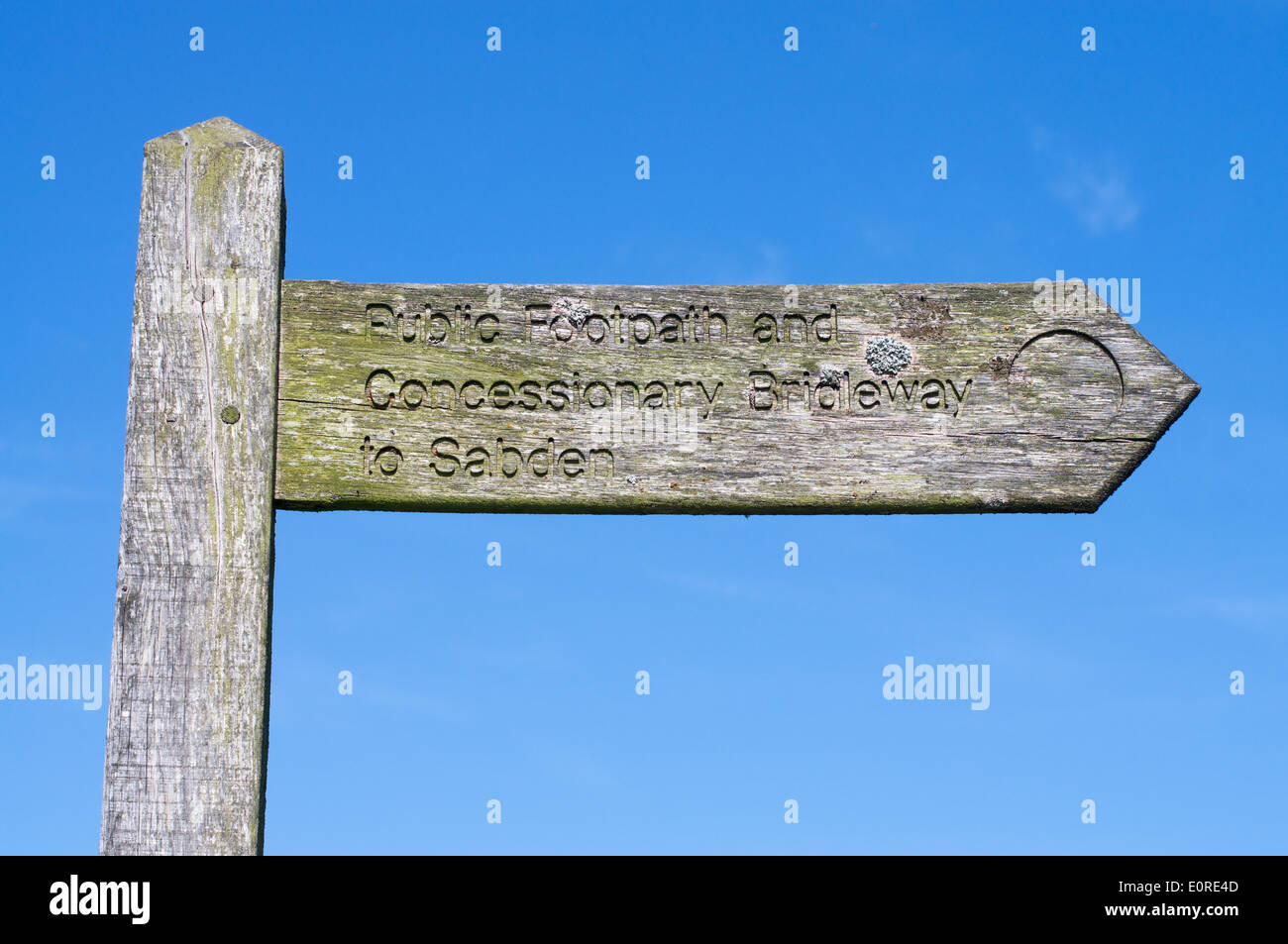 Wooden footpath sign against a blue sky on Pendle Hill, Sabden ...