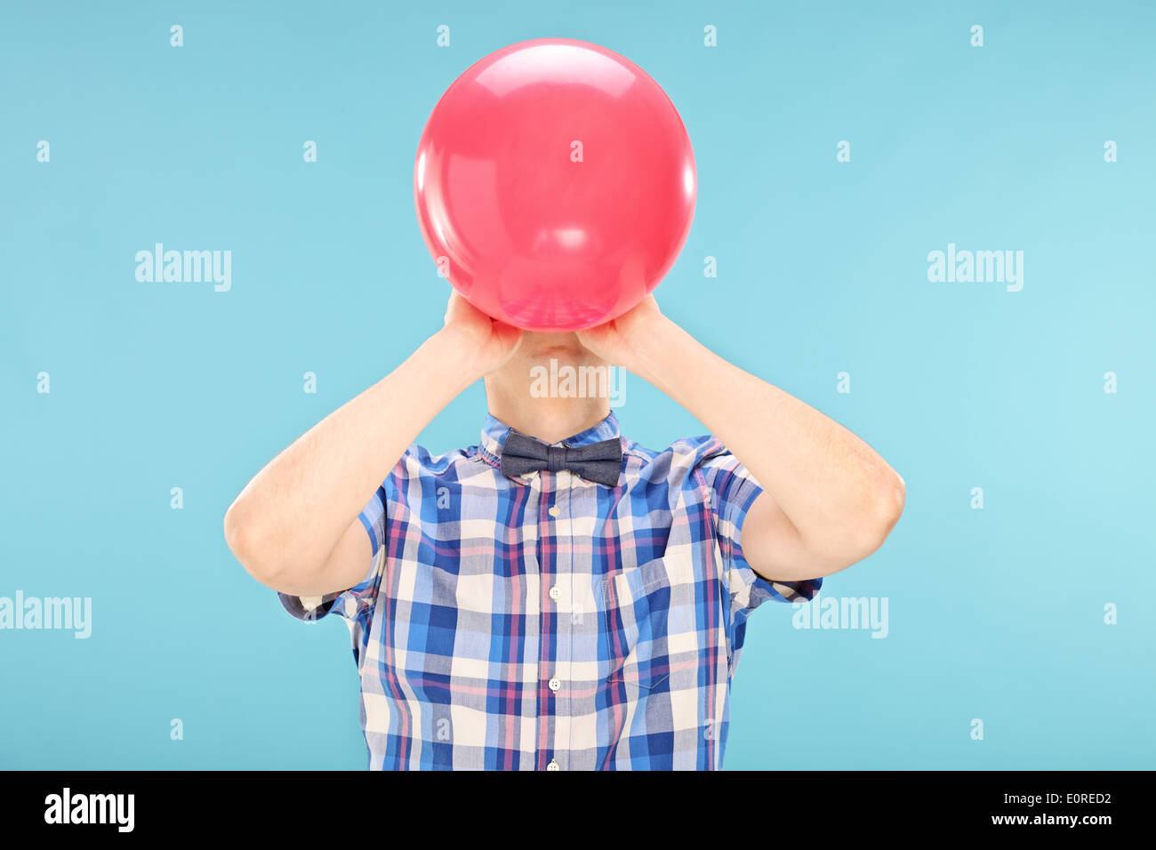 Blowing balloon male hi-res stock photography and images - Alamy