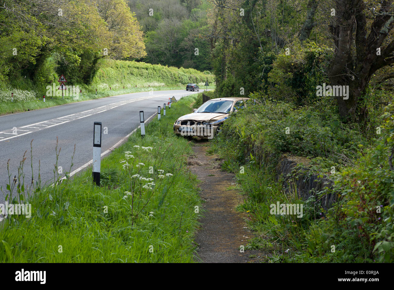 A crashed Rover 25 car beside the A374 road at Trerule Foot near ...