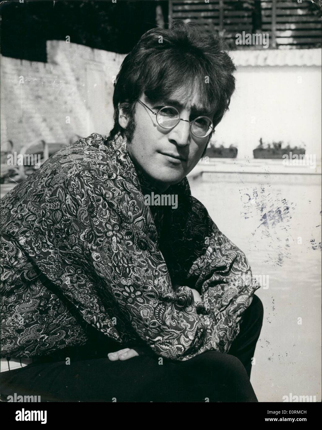 Jan 1, 1960 - Relaxing at home in the sun - Beatle John Lennon Stock ...