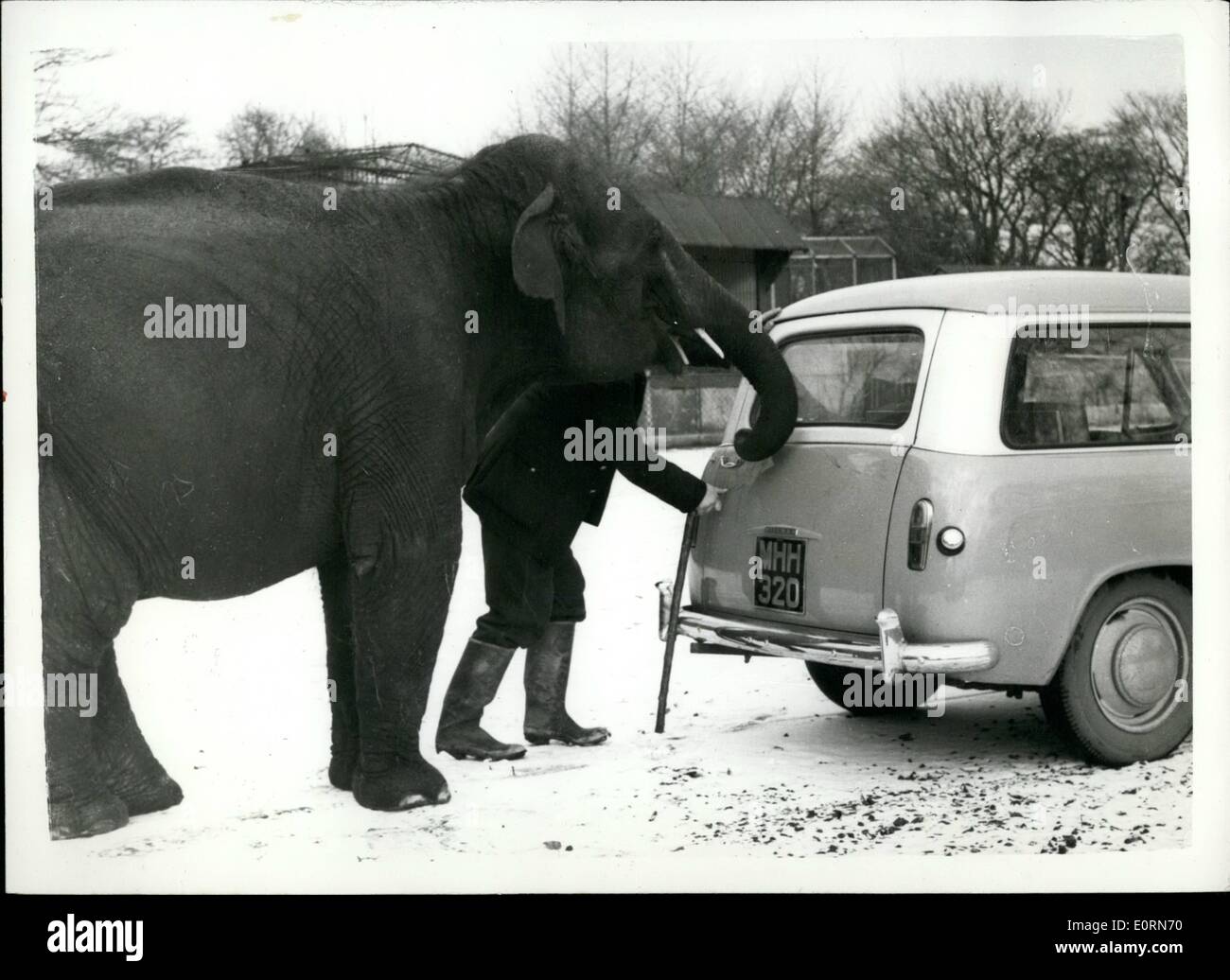 Jan. 19, 1960 - 19-1-60 The slipping car gets help. Three tons of it ...