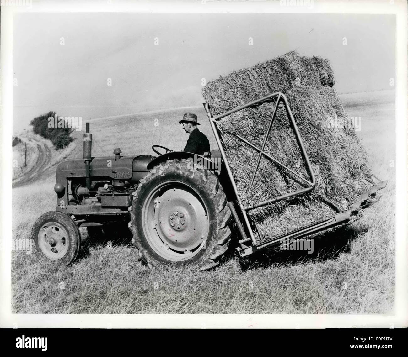 Feb. 02, 1960 - Farmer Invents New Hayride: Behind a tractor and on its ...