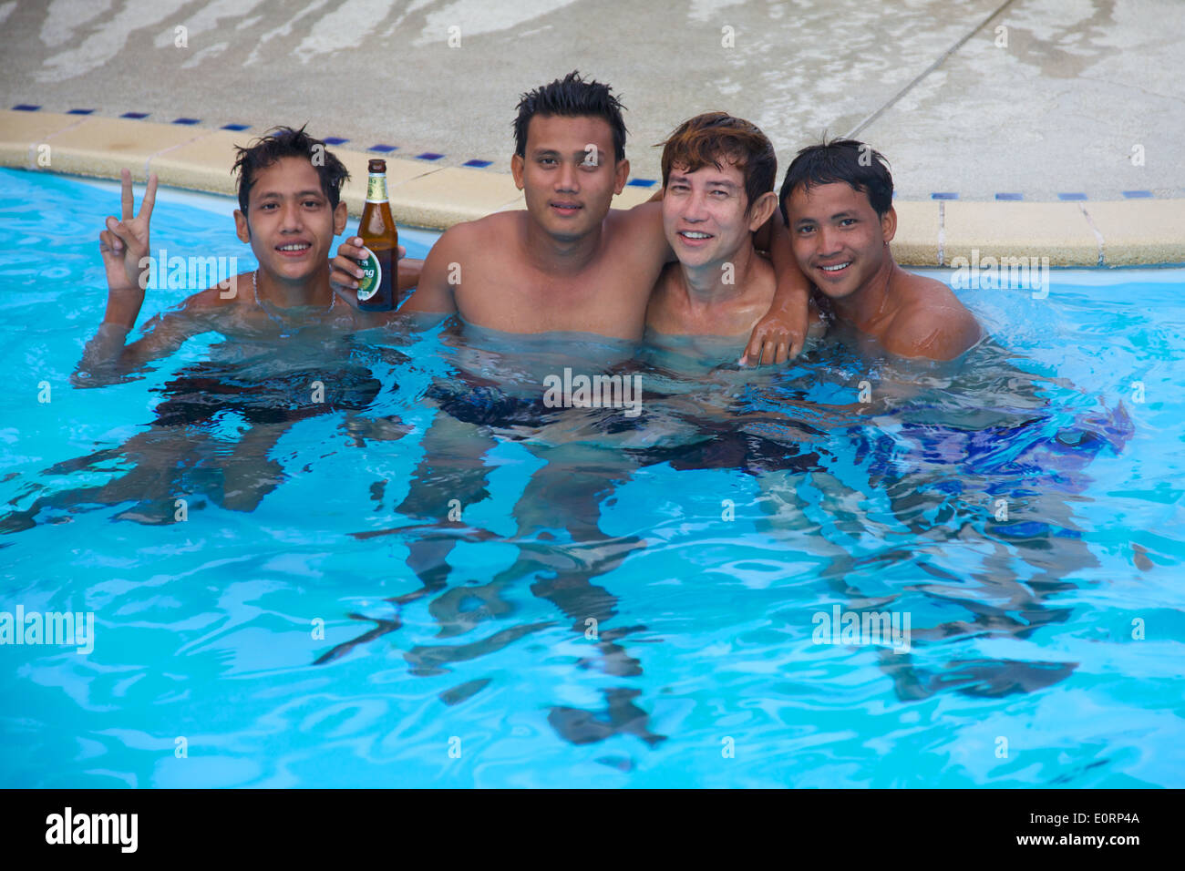 4 Thai guys having fun in a swimming pool, Phuket Thailand Stock Photo ...