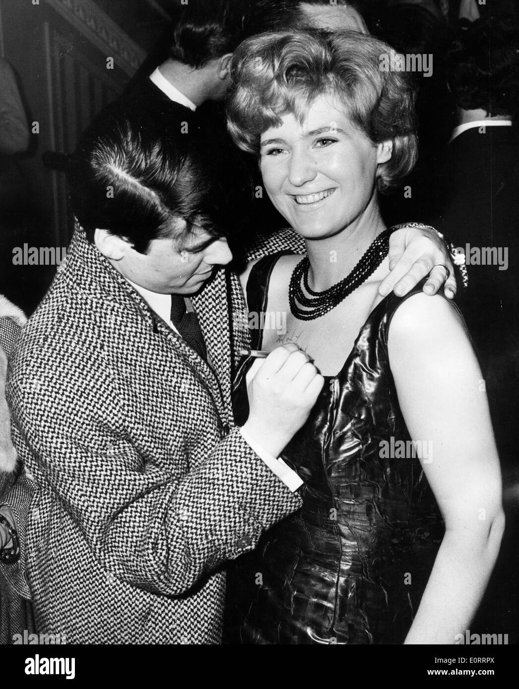 Singer Mike Pender autographs Patsy Fagan Stock Photo - Alamy