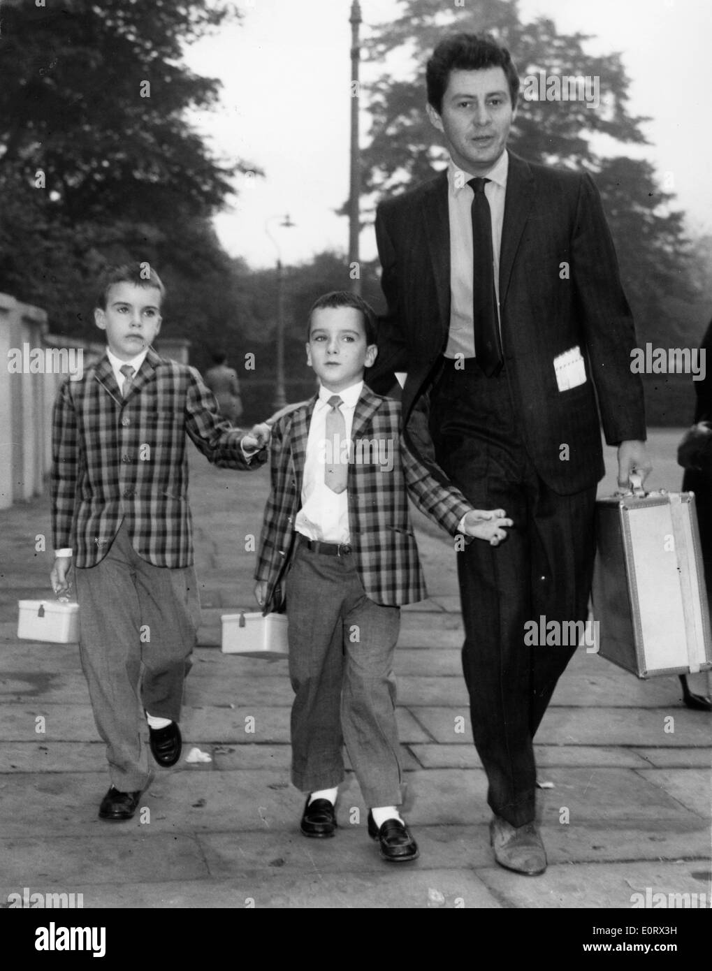 Singer Eddie Fisher walks with two sons Stock Photo - Alamy