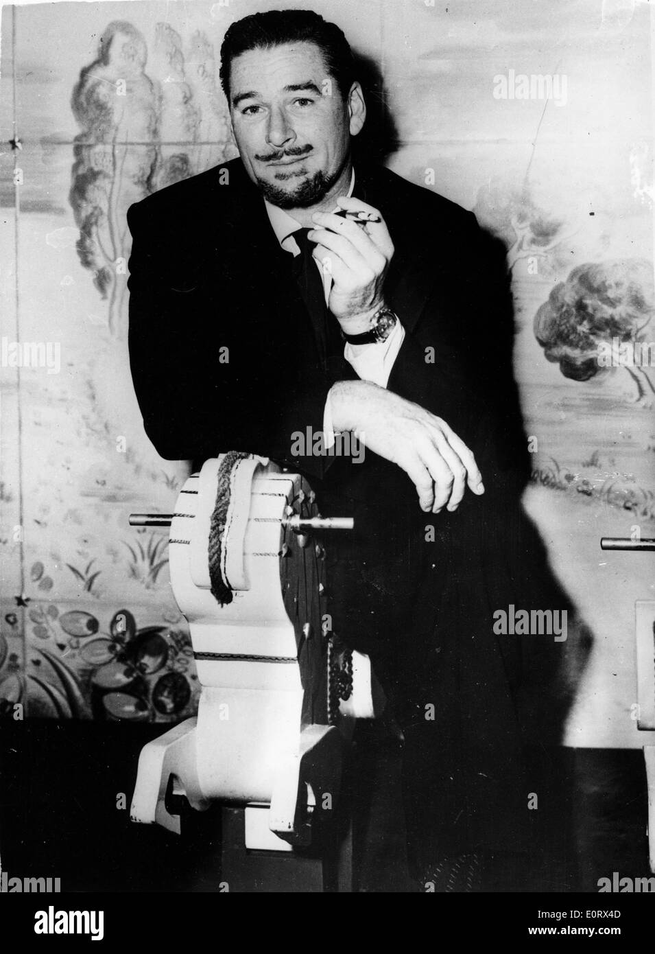 Actor Errol Flynn sits on rocking horse Stock Photo - Alamy