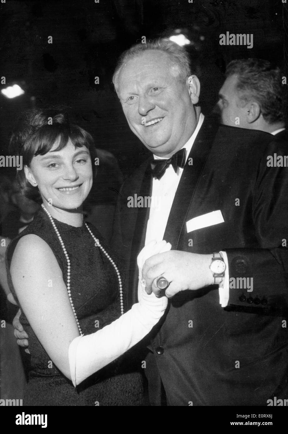 Actor Gert Frobe dancing with woman at party Stock Photo - Alamy