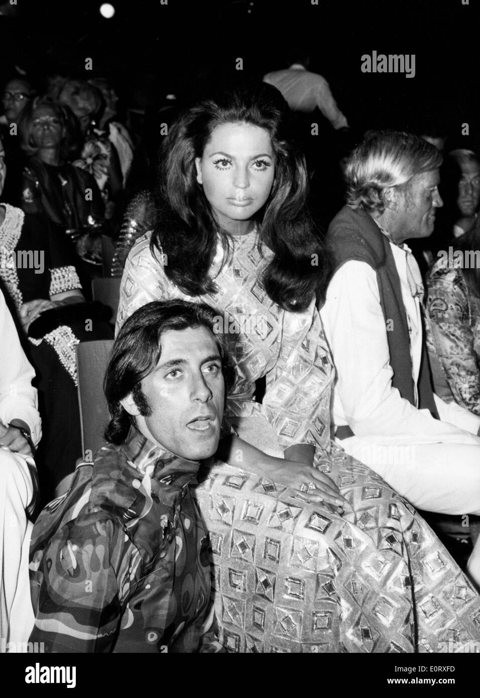 Woman dark hair seated in Black and White Stock Photos & Images - Alamy