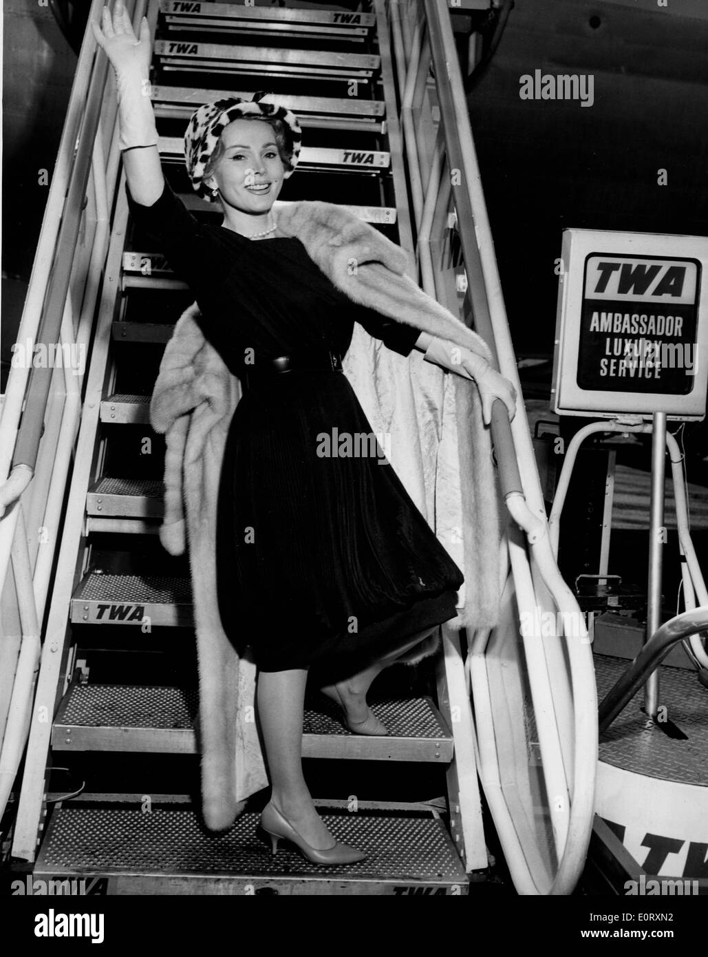 Actress Zsa Zsa Gabor waves while boarding plane Stock Photo - Alamy