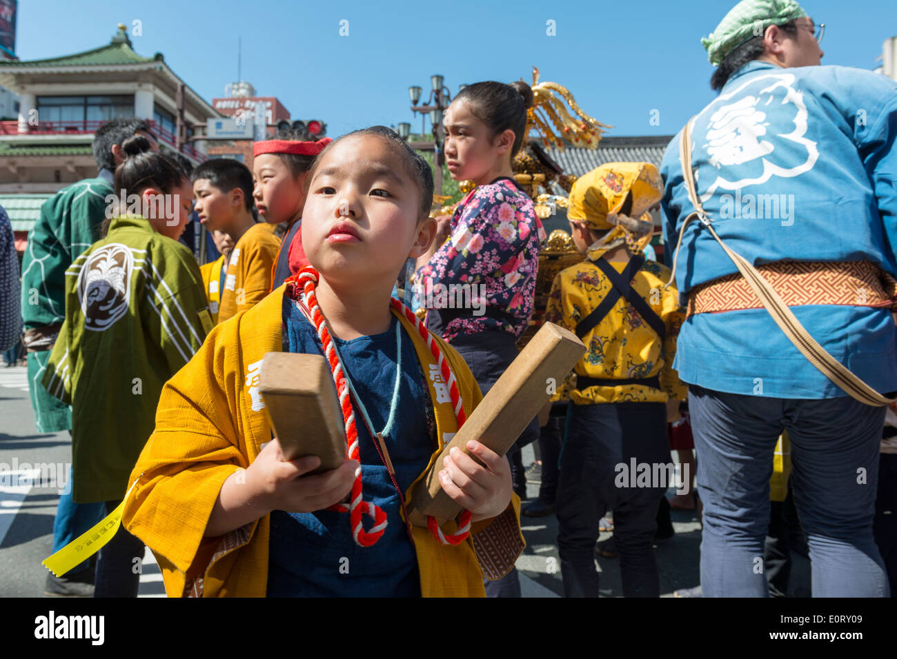 Young girl in a happi with hyoshigi at Sanja Matsuri at Sensō-ji ...