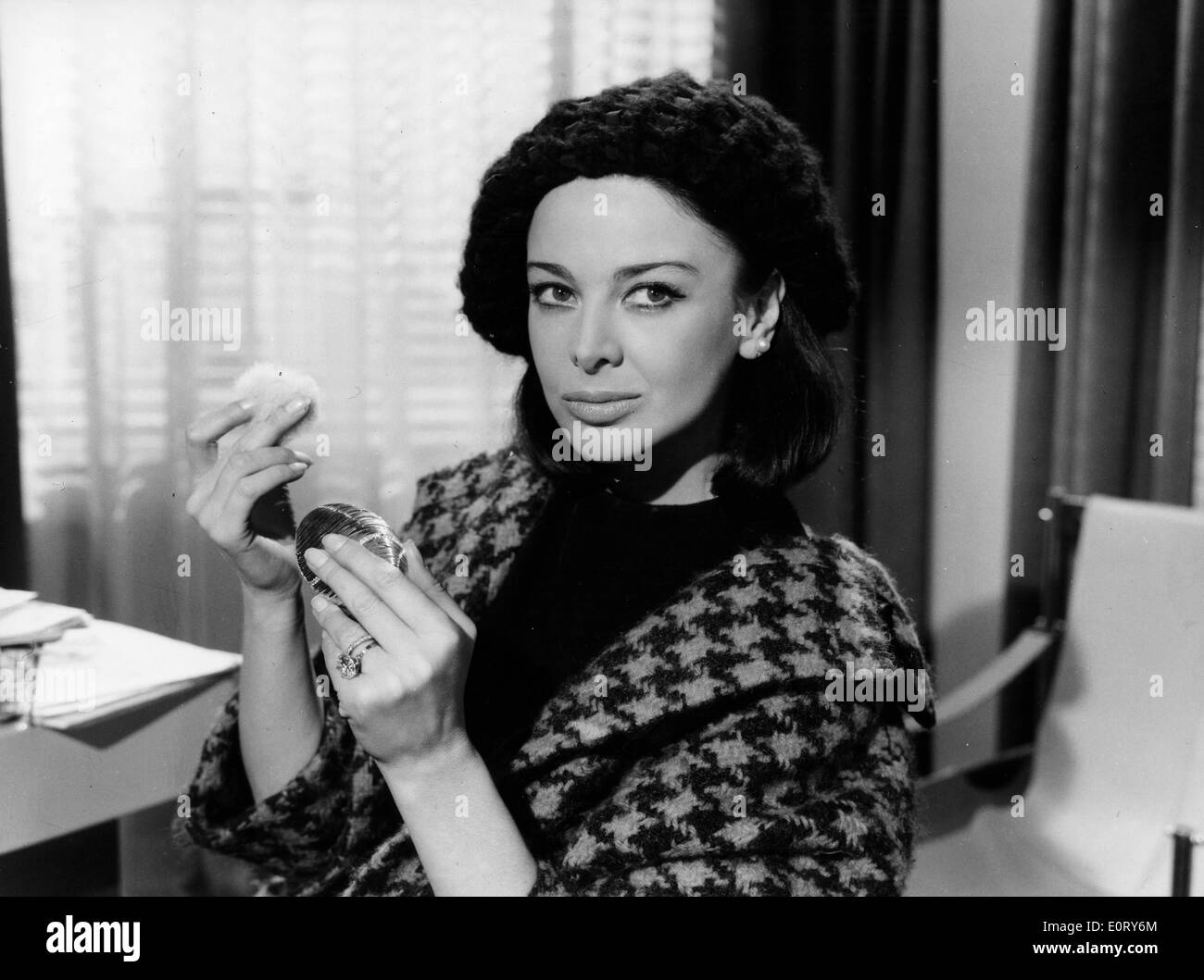 Actress Eleonora Rossi Drago fixes her makeup Stock Photo - Alamy