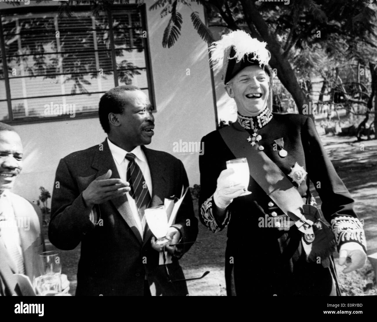 First president of Botswana SERETSE KHAMA, left, jokes with a man in ...