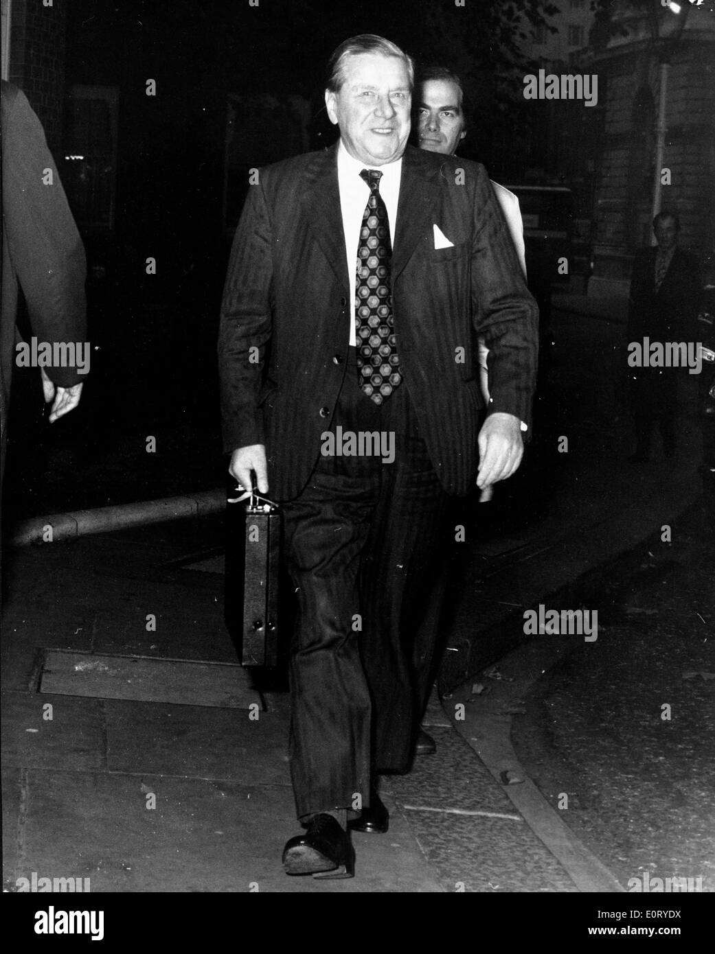 Politician Victor Feather walking on the sidewalk Stock Photo - Alamy