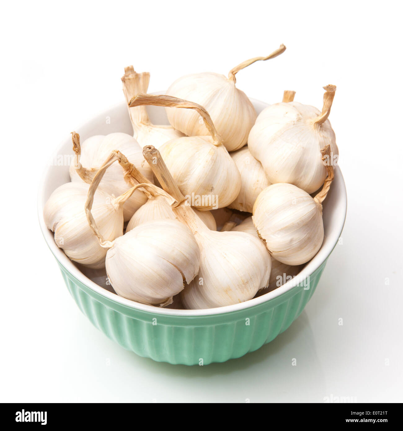 Bowl of garlic bulbs isolated on a white studio background Stock Photo ...