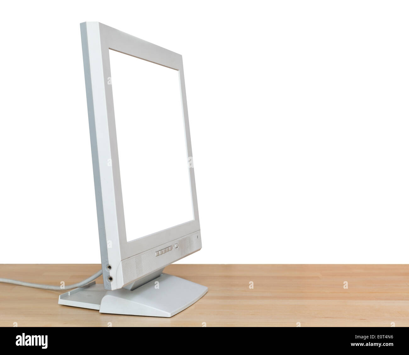 side view of grey display with cut out screen on wooden table isolated ...