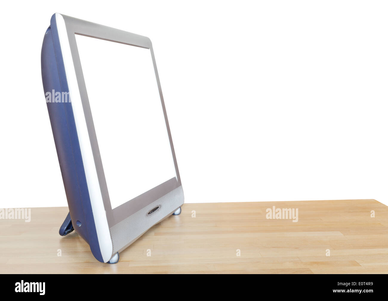 side view of TV set display with cut out screen on wooden table ...