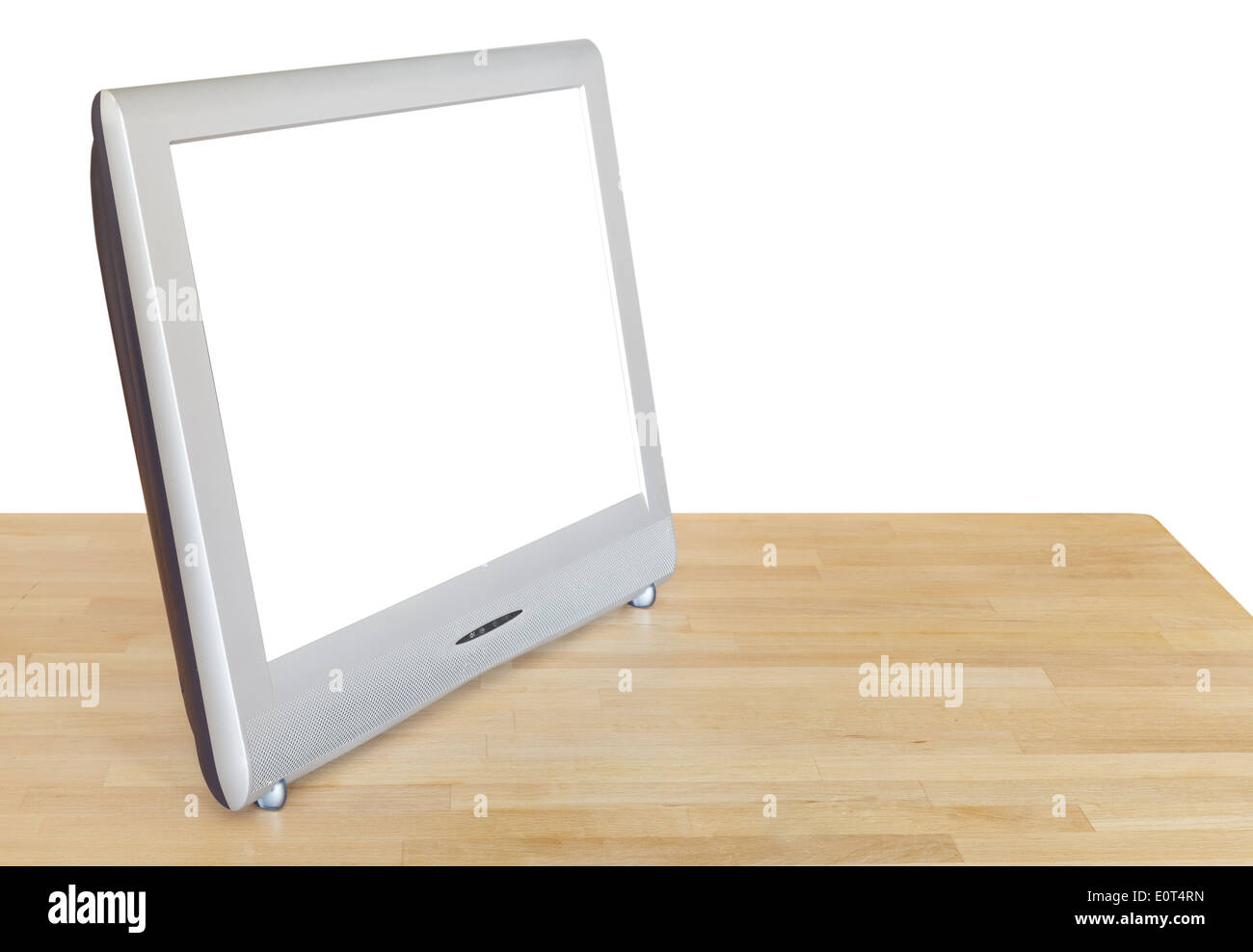 side view of grey TV set display with cut out screen on wooden table ...