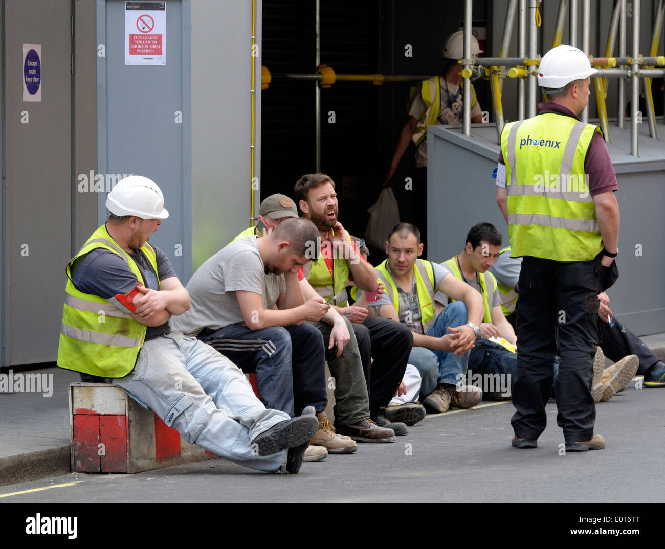 London, England, UK. Workmen taking a break in the street Stock Photo ...