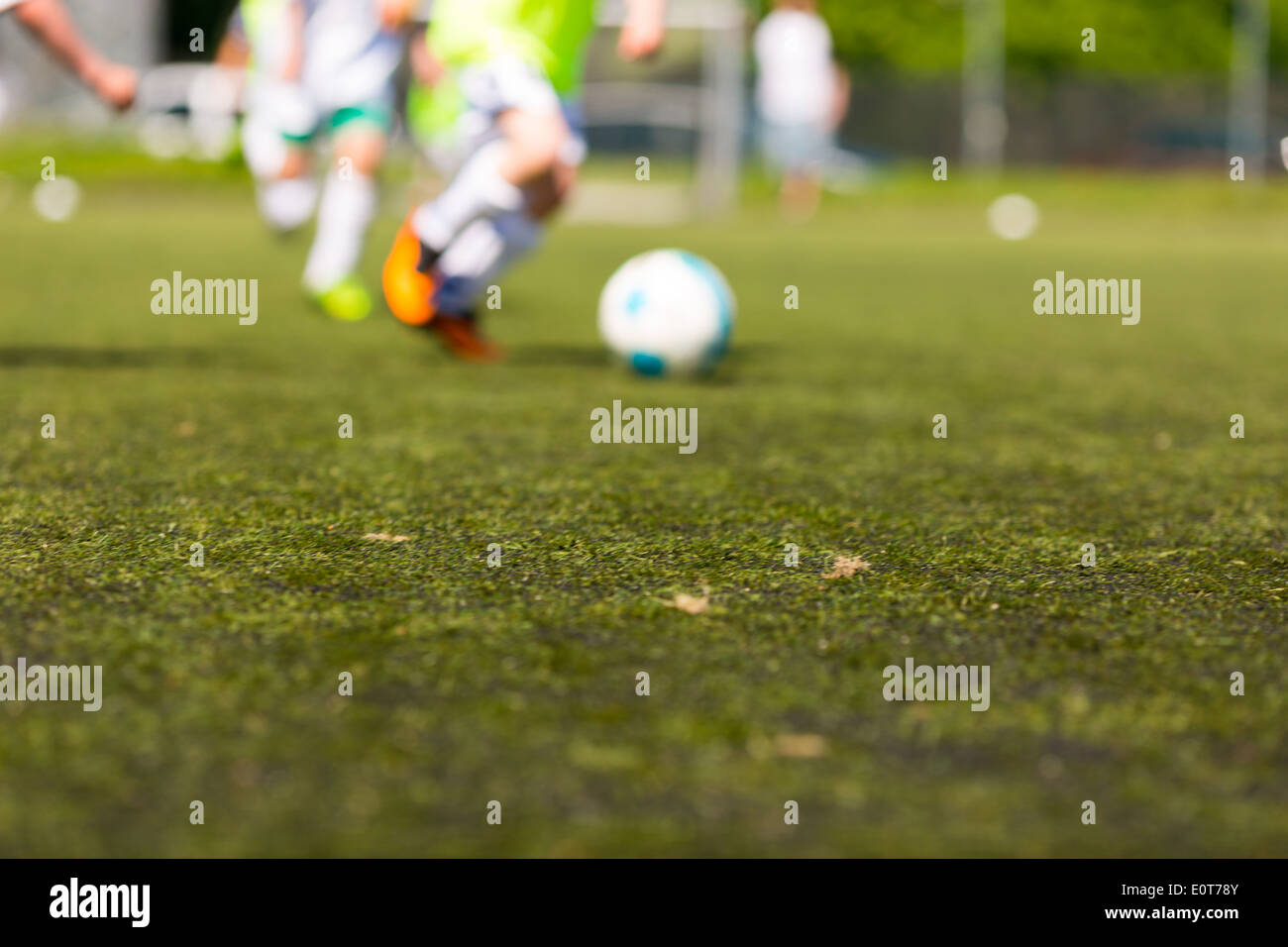 Children playing football and pitch hi-res stock photography and images ...