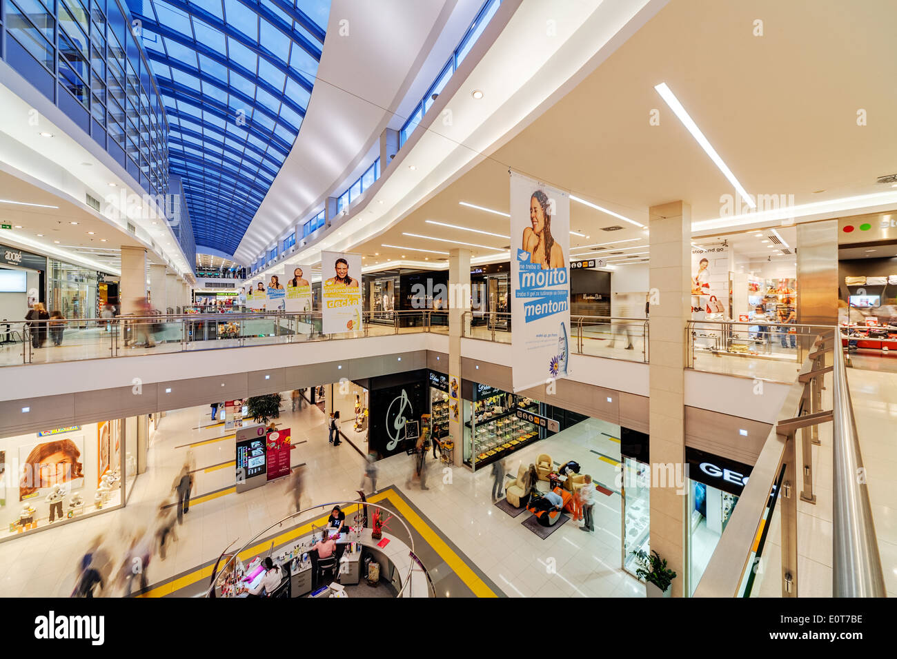 interior of shopping mall with people walking Stock Photo - Alamy