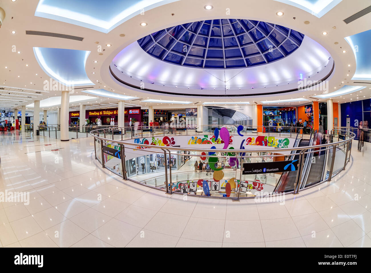 interior of shopping mall with people walking Stock Photo - Alamy