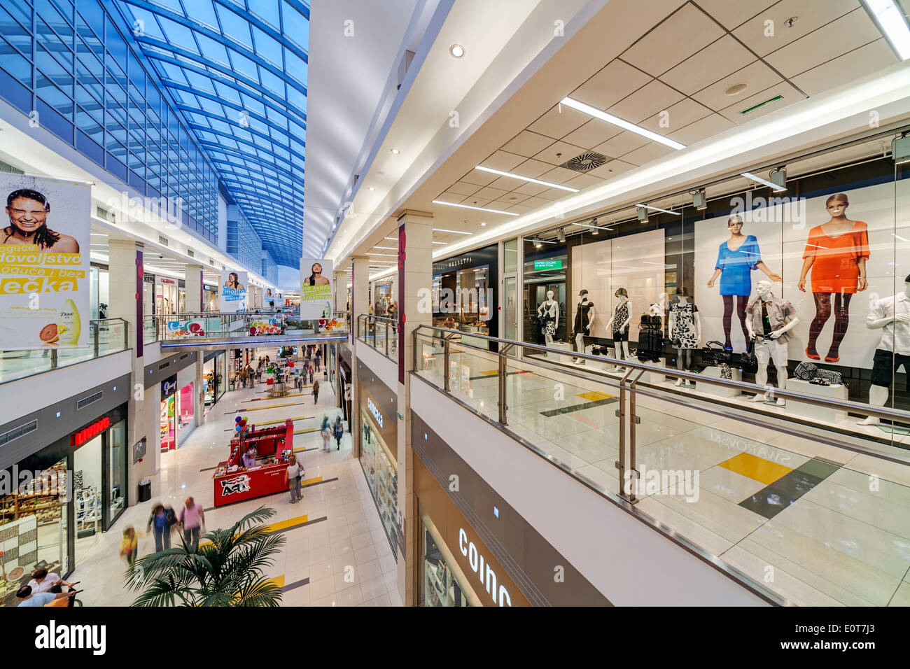 interior of shopping mall with people walking Stock Photo - Alamy
