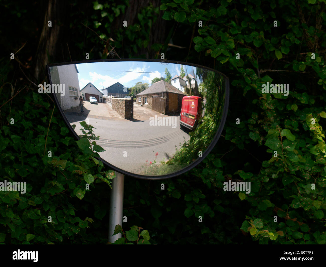 Mirror to see traffic on a concealed drive, Cornwall, UK Stock Photo ...