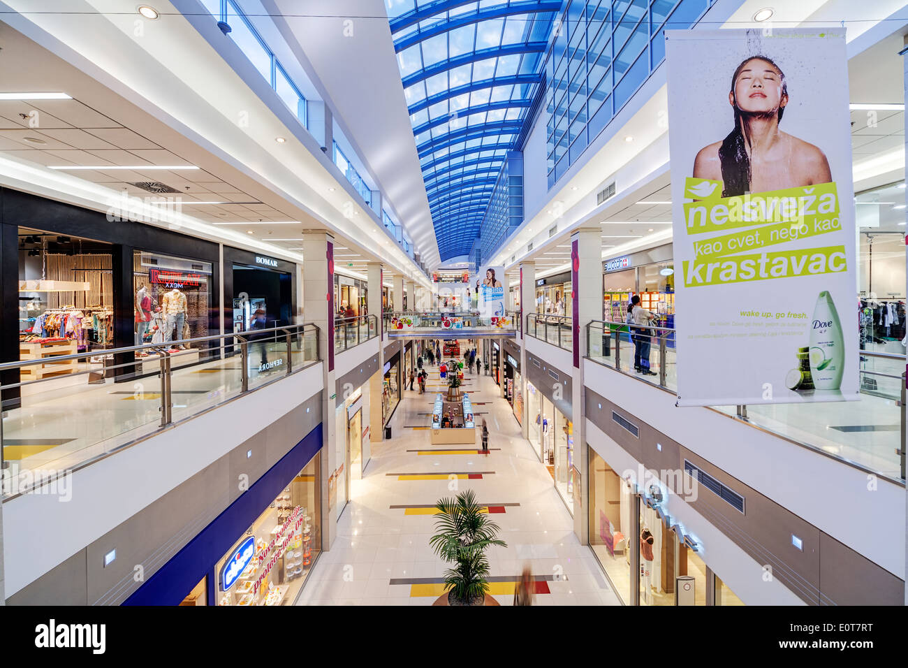 interior of shopping mall with people walking Stock Photo - Alamy