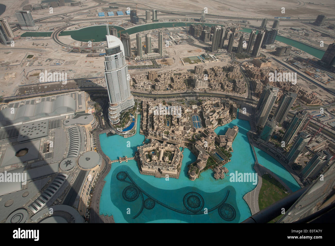 View of Dubai Lake with the shadow of Burj Dubai cast across the ground ...
