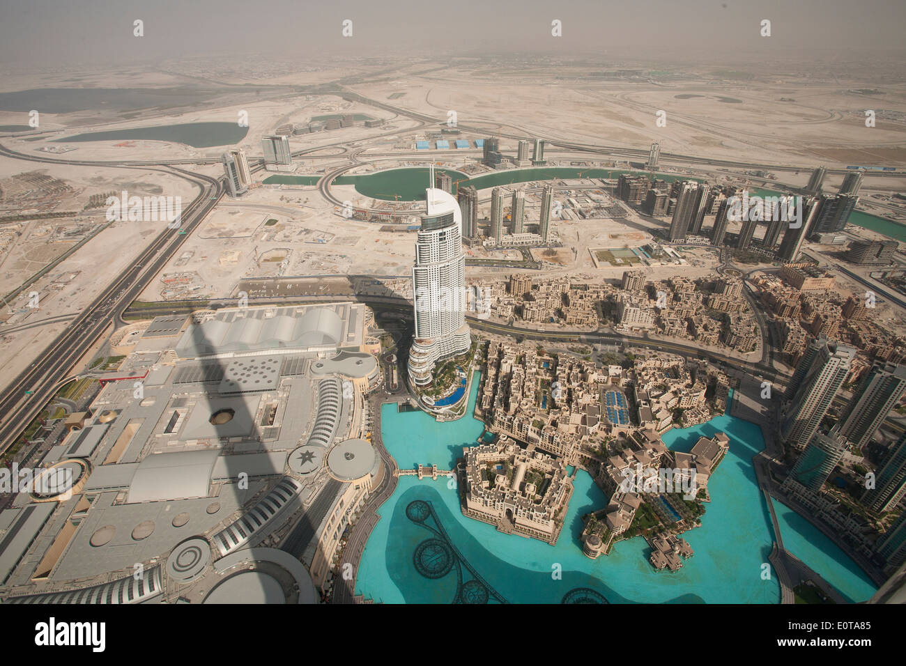 View of Dubai Lake with the shadow of Burj Dubai cast across the ground ...