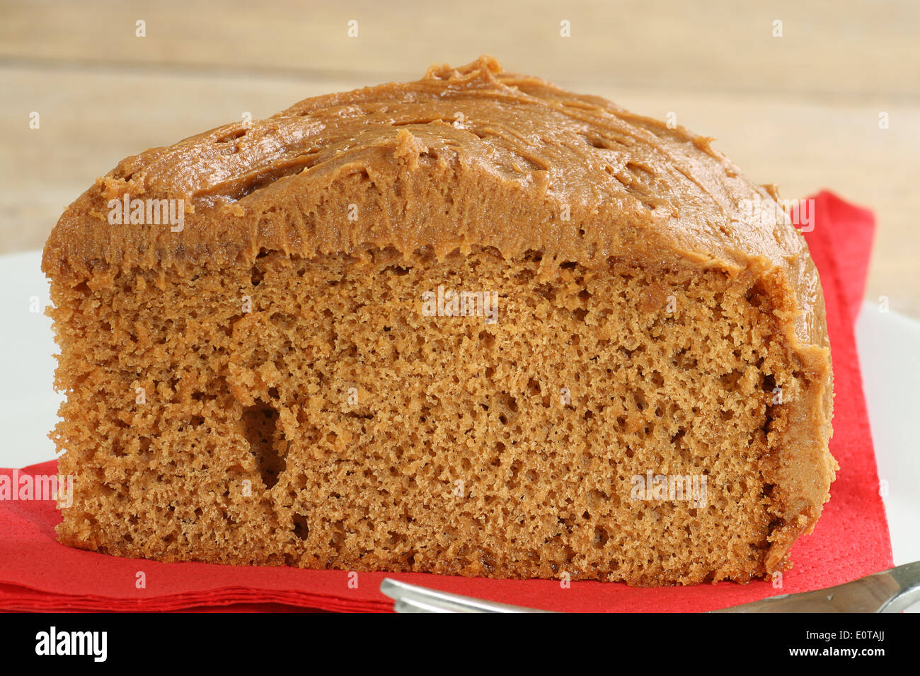 slice of moist toffee fudge cake with toffee cream topping Stock Photo ...