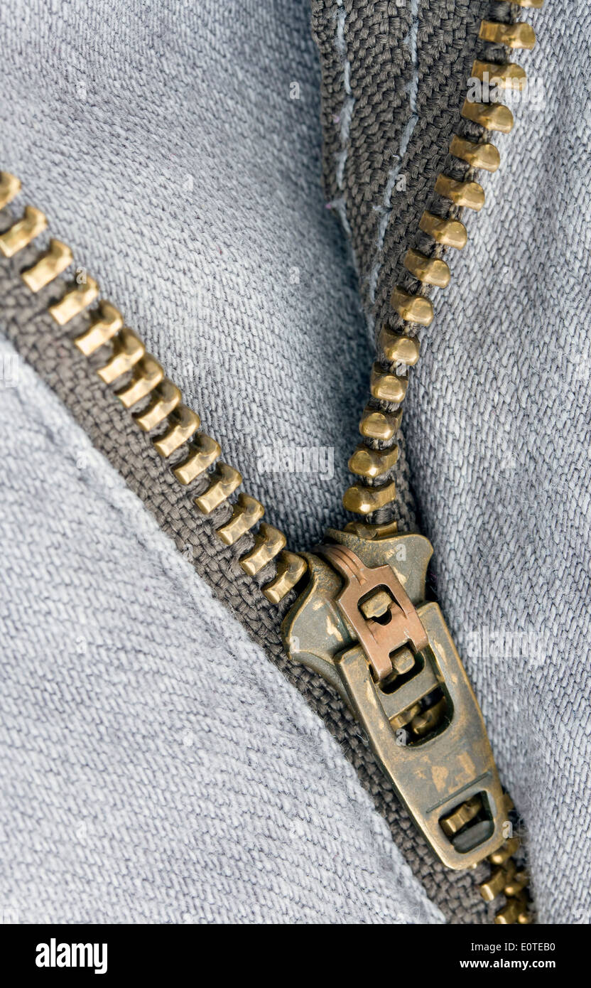 Close up zipper on a pair of grey jeans Stock Photo - Alamy
