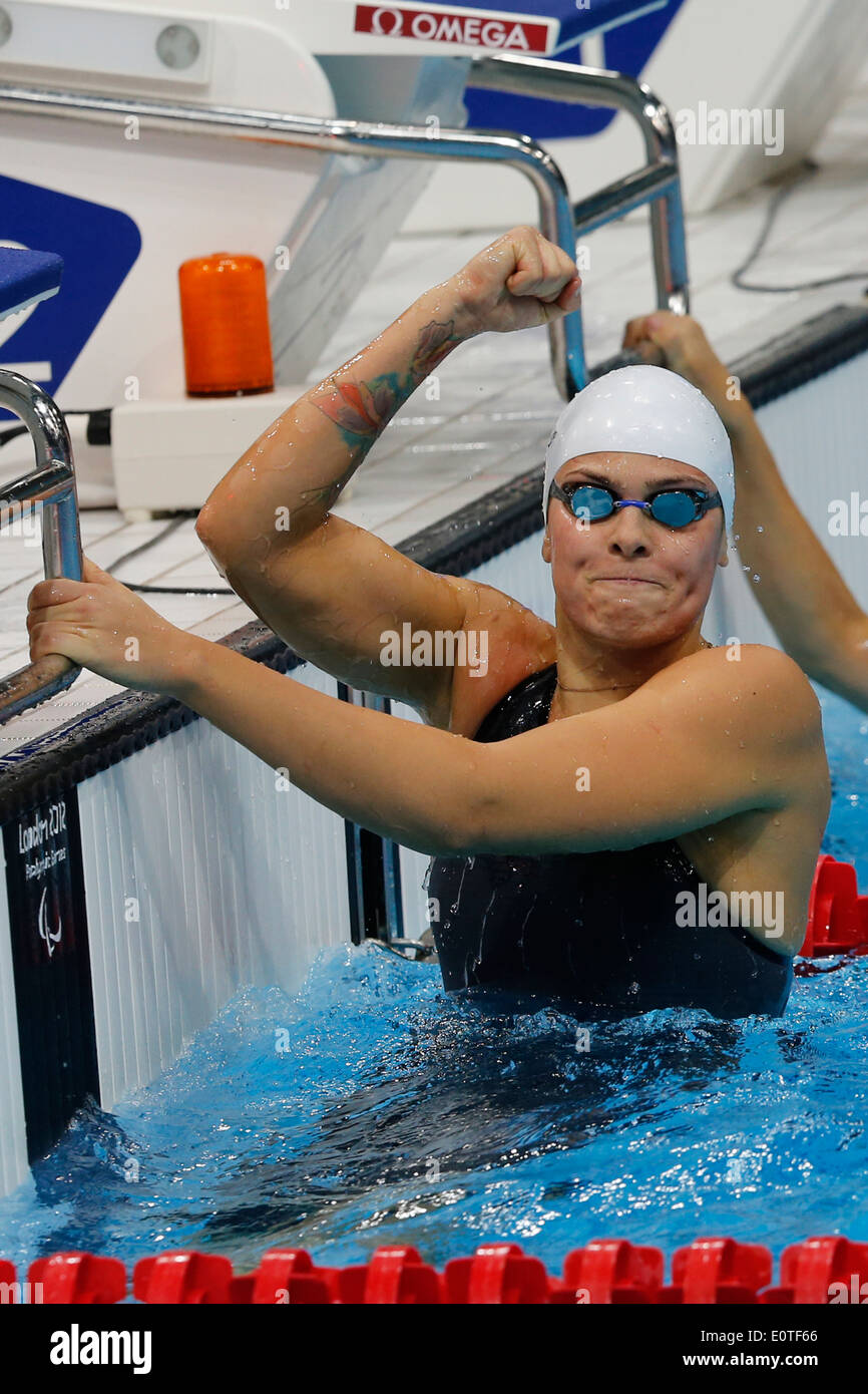 Oxana Savchenko of Russia celebrates winning gold following the women's ...