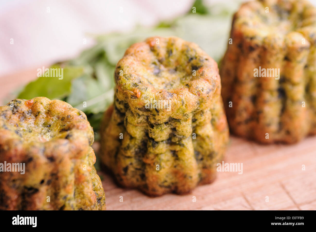 Spinach and salmon canneles, a variation of the traditional cannele ...