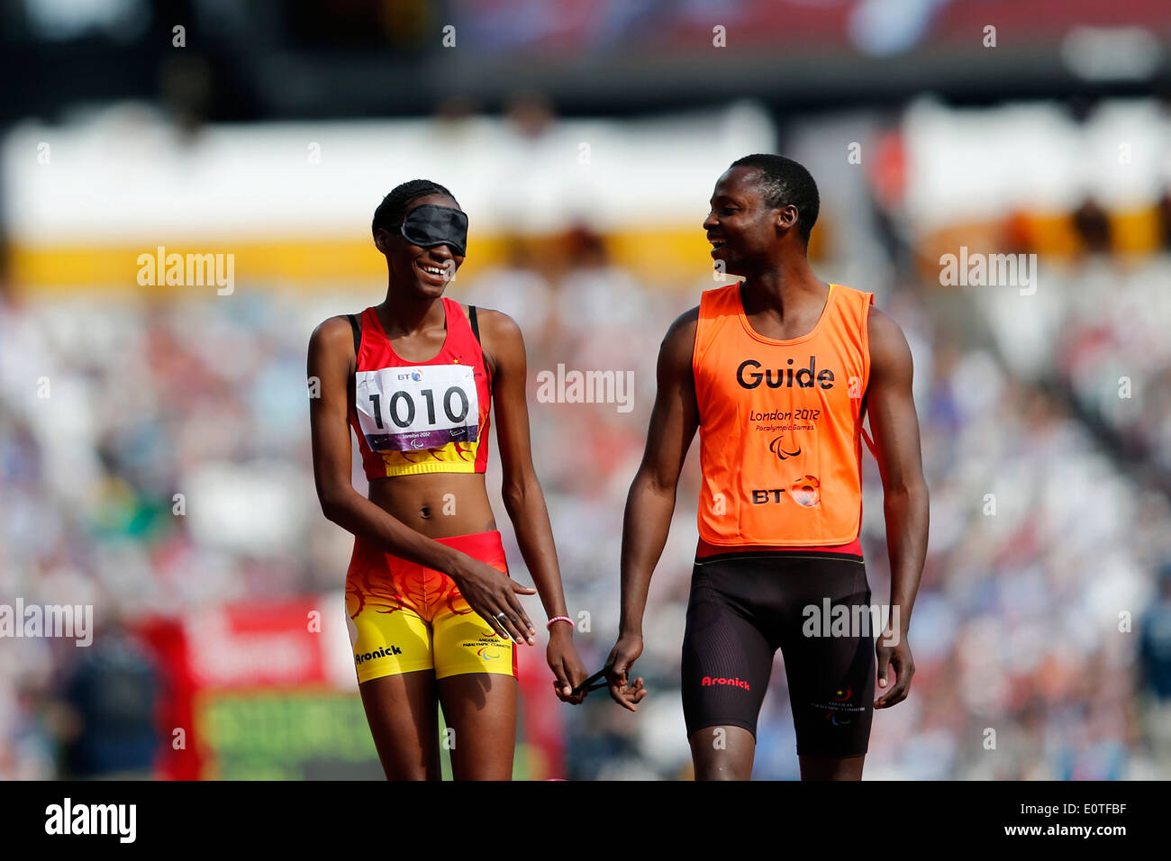 Maria Gomes Da Silva of Angola and her guide smile before the women's ...