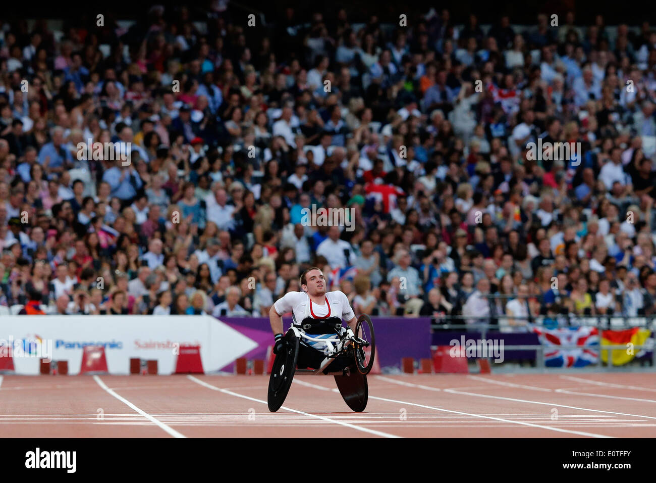 Mickey Bushell of Great Britain (C) celebrates winning gold following ...