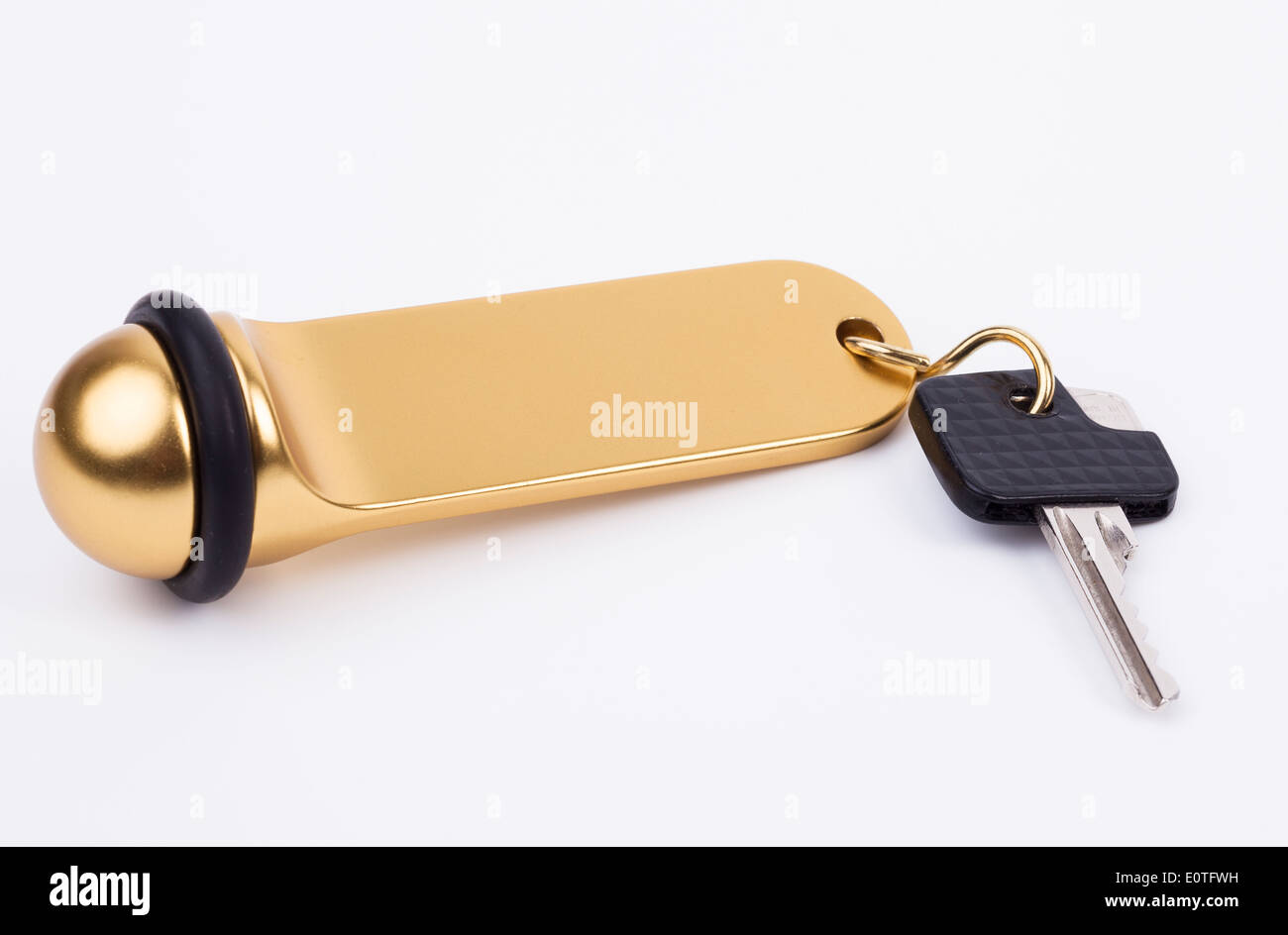 Key with golden key fob Stock Photo - Alamy