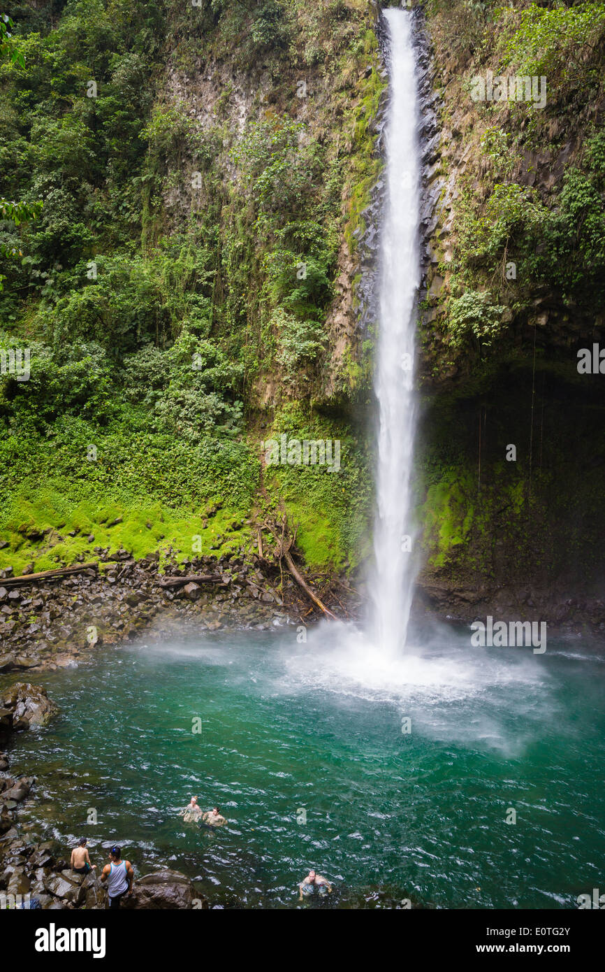Bathers in the plunge pool of La Fortuna Waterfall or Catarata Fortuna ...