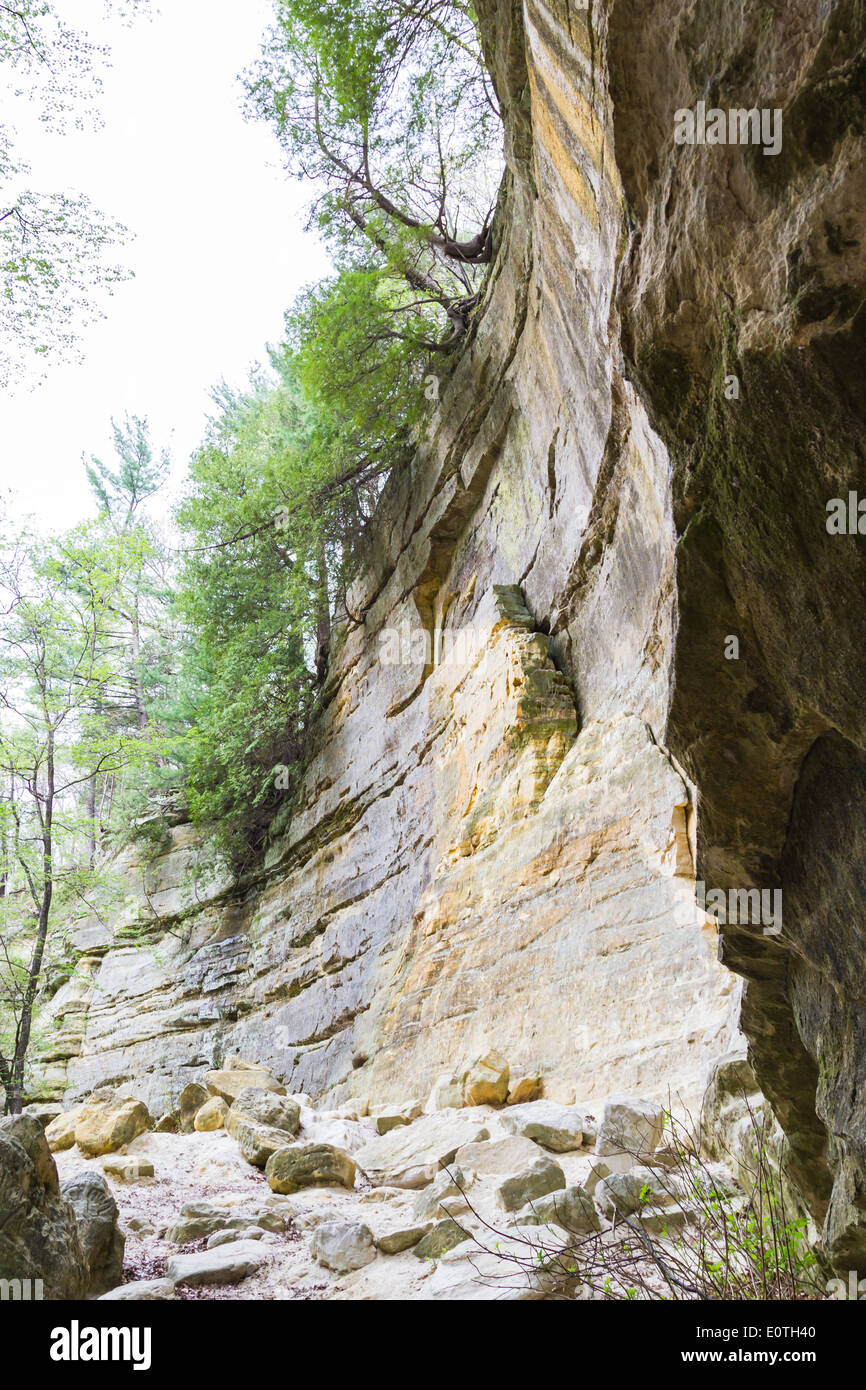 large sandstone cliffs with rocks that have fallen in the past turning ...